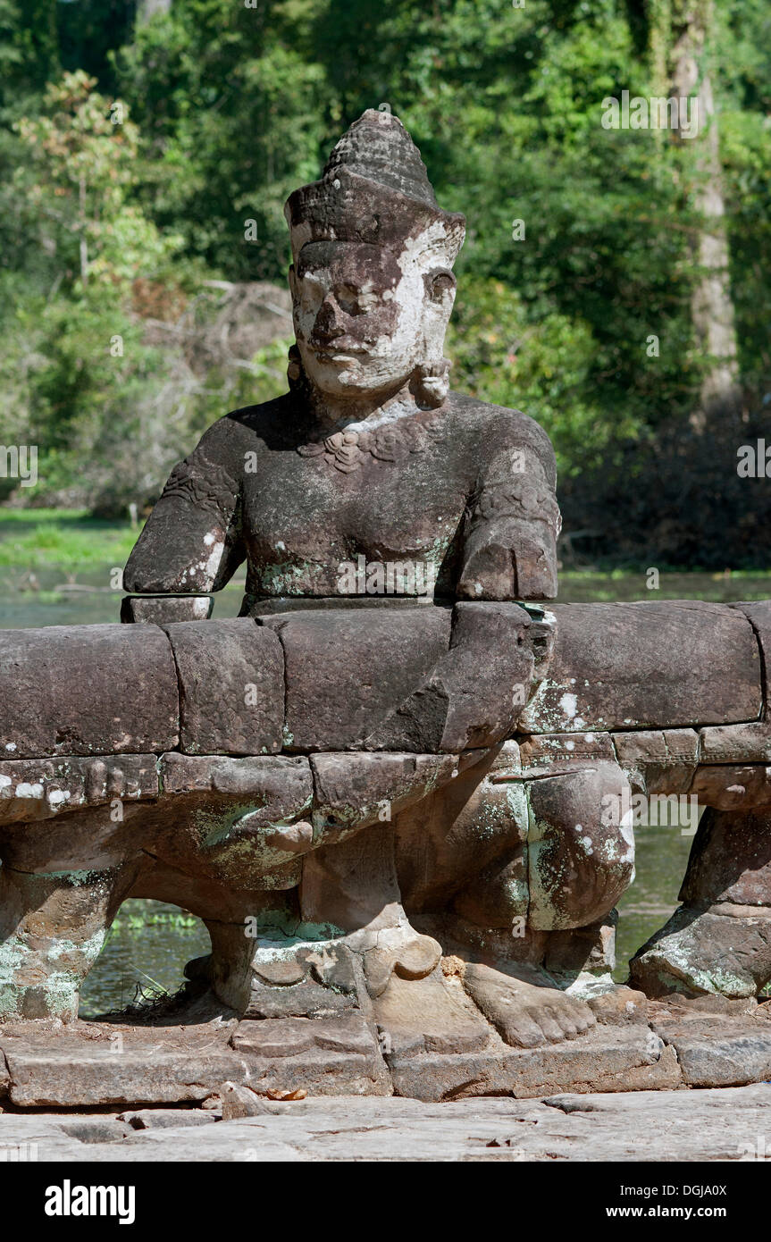Asura statue bearing the giant snake Naga, on the balustrade of the ...
