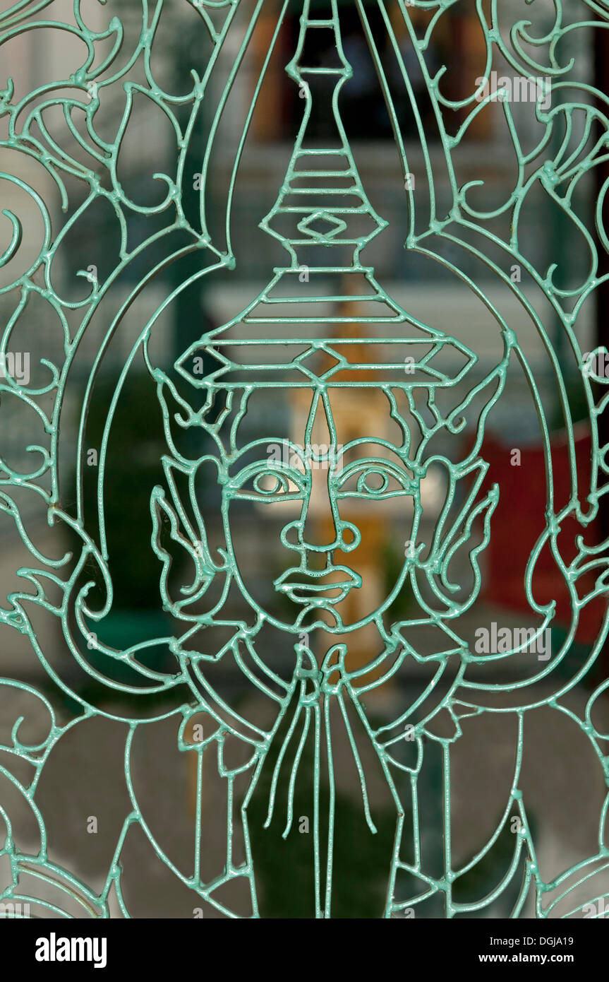 Metal mesh gate with a representation of Buddha in the Royal Palace ...
