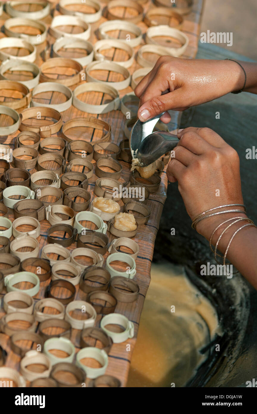 Production of traditional palm sugar candies, caramelized palm sugar is ...