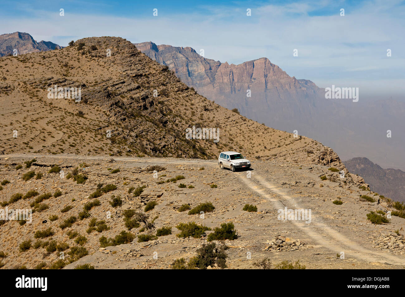 Off-road vehicle on a track in the rugged mountain landscape at the ...