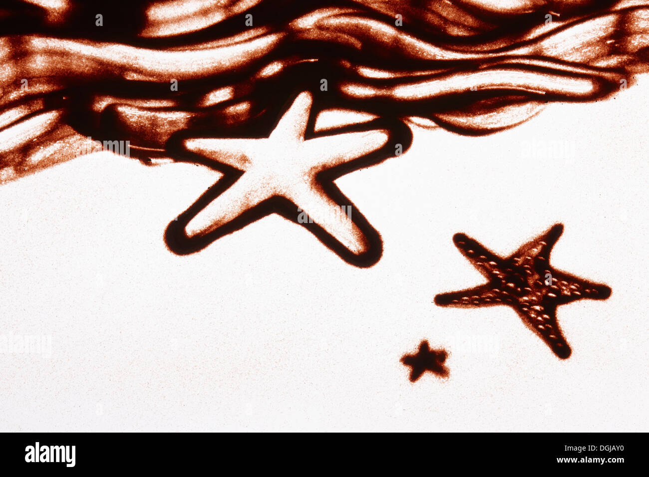 a sand drawing of star fishes on the beach Stock Photo - Alamy