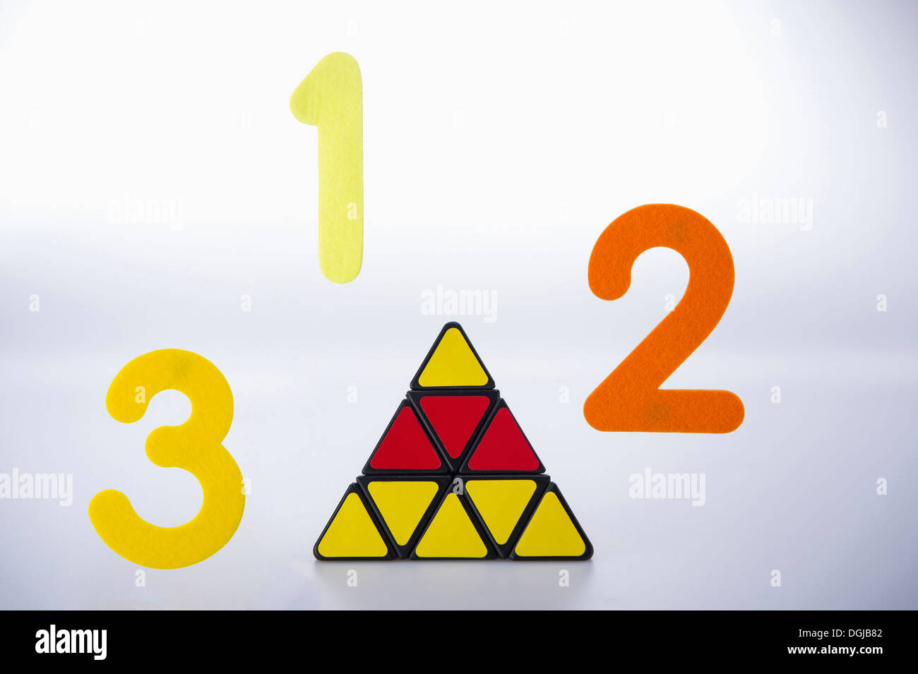 numbers and a Rubik's triangle Stock Photo - Alamy