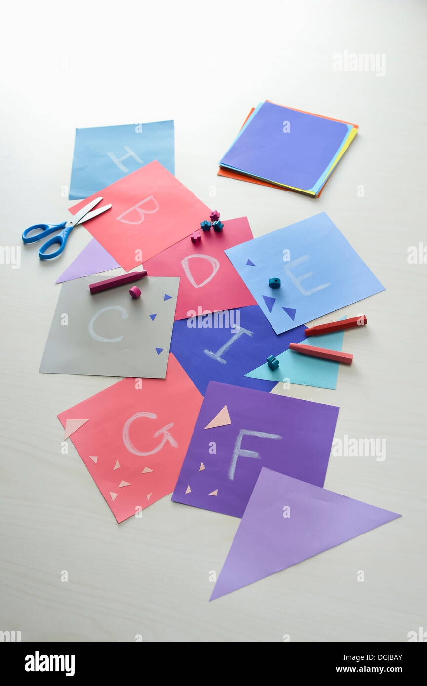 different color papers on a desk Stock Photo - Alamy