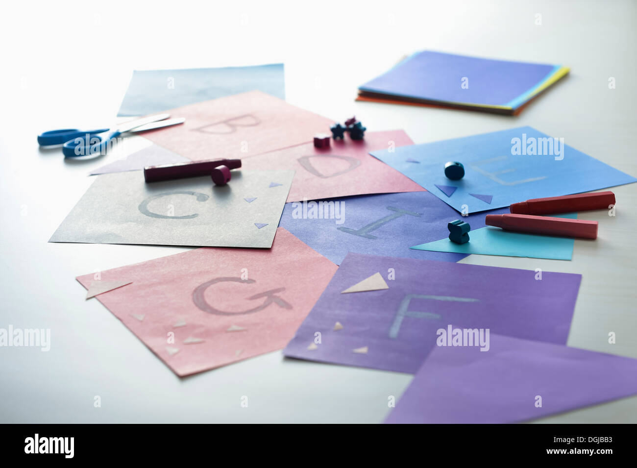 different color papers on a desk Stock Photo - Alamy