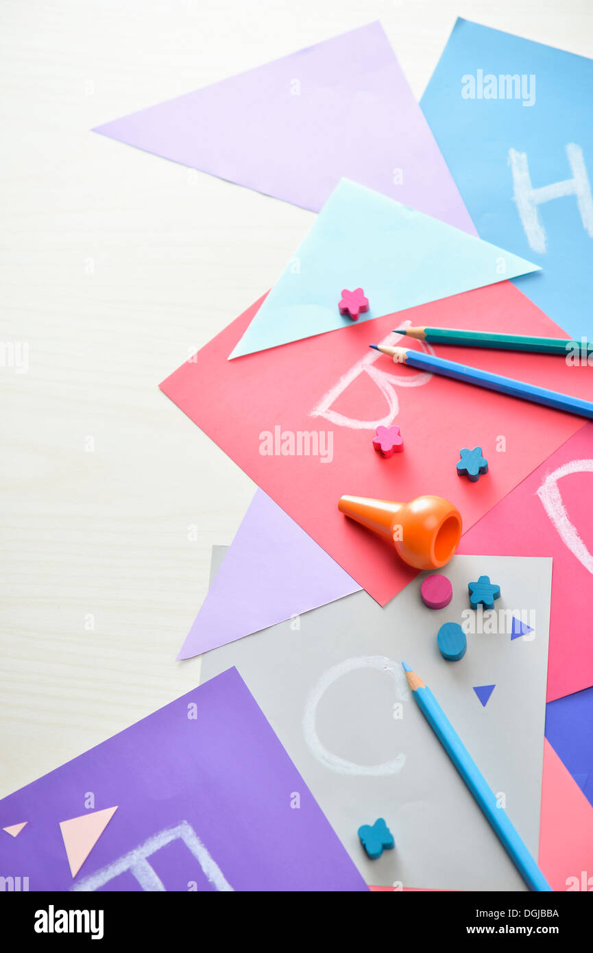 different color papers on a desk Stock Photo - Alamy
