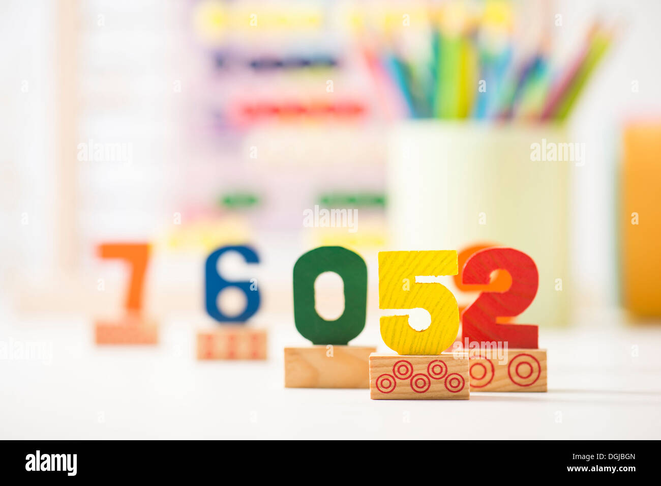 several different color numbers on a desk Stock Photo - Alamy