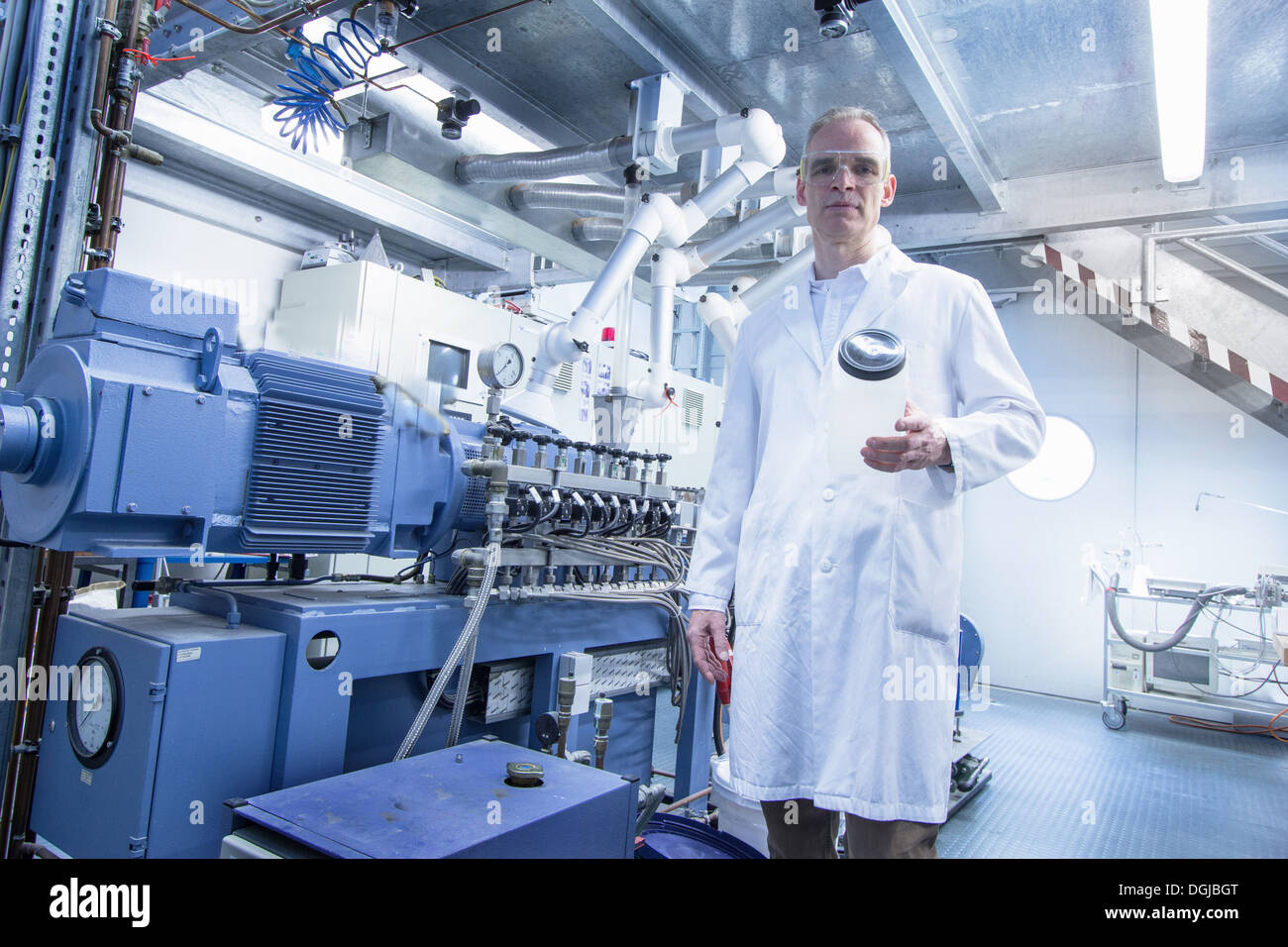 Portrait of lab technician holding empty glass jar Stock Photo - Alamy