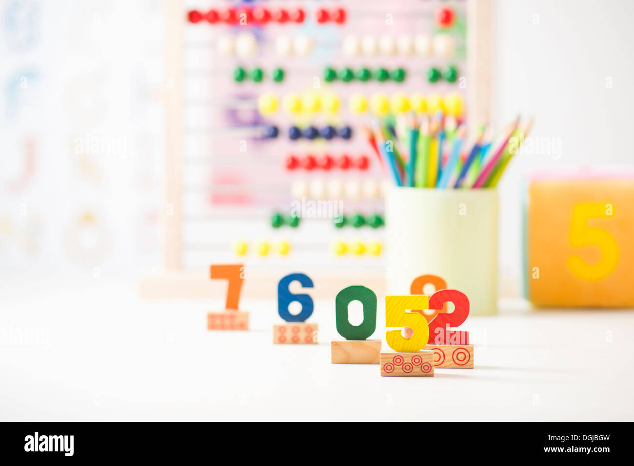 several different color numbers on a desk Stock Photo - Alamy