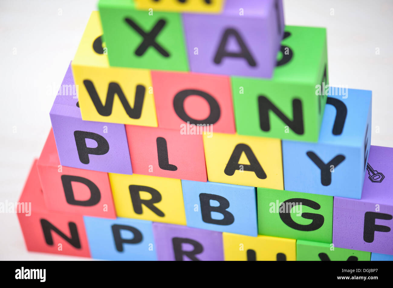 piles of different color cubes with letters Stock Photo - Alamy
