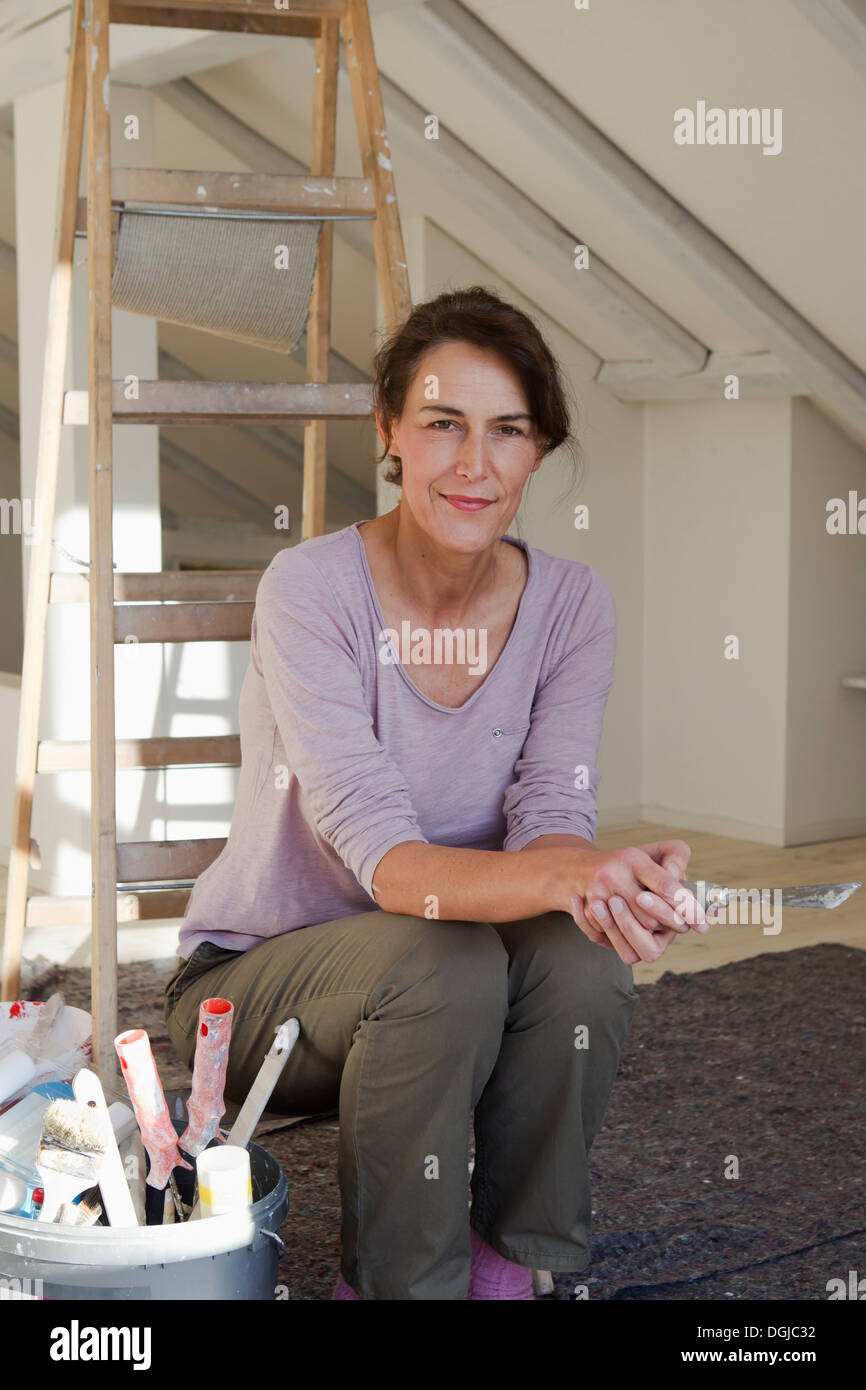 Portrait of woman in loft Stock Photo - Alamy