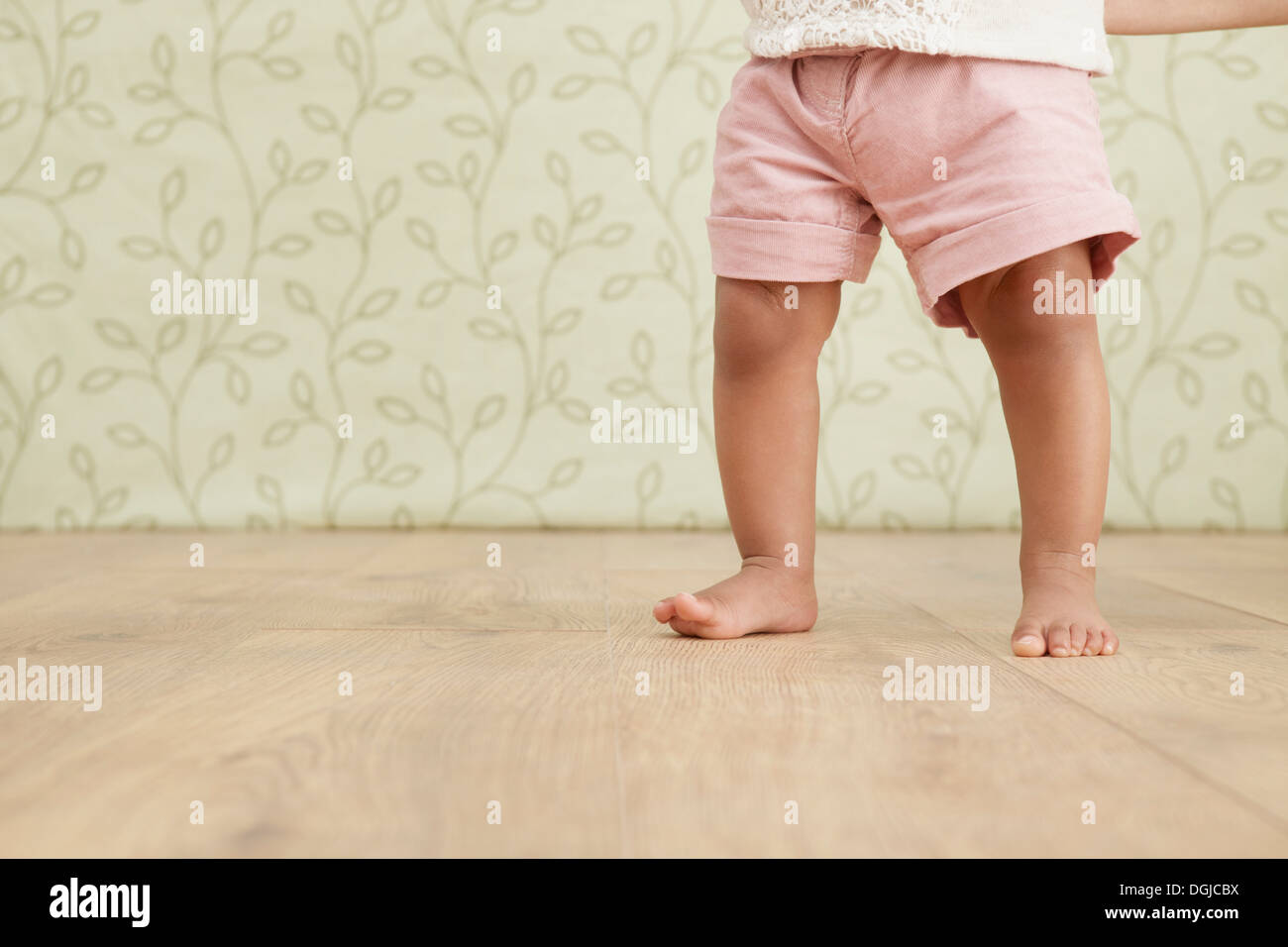 Baby taking its first steps hi-res stock photography and images - Alamy