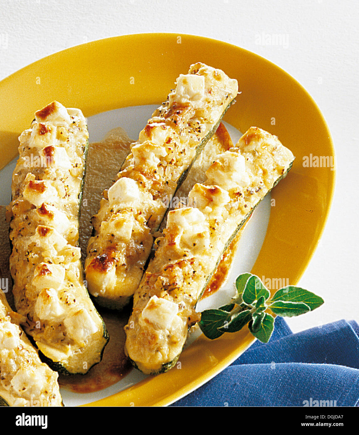 Courgettes stuffed with rice and cheese hi-res stock photography and ...
