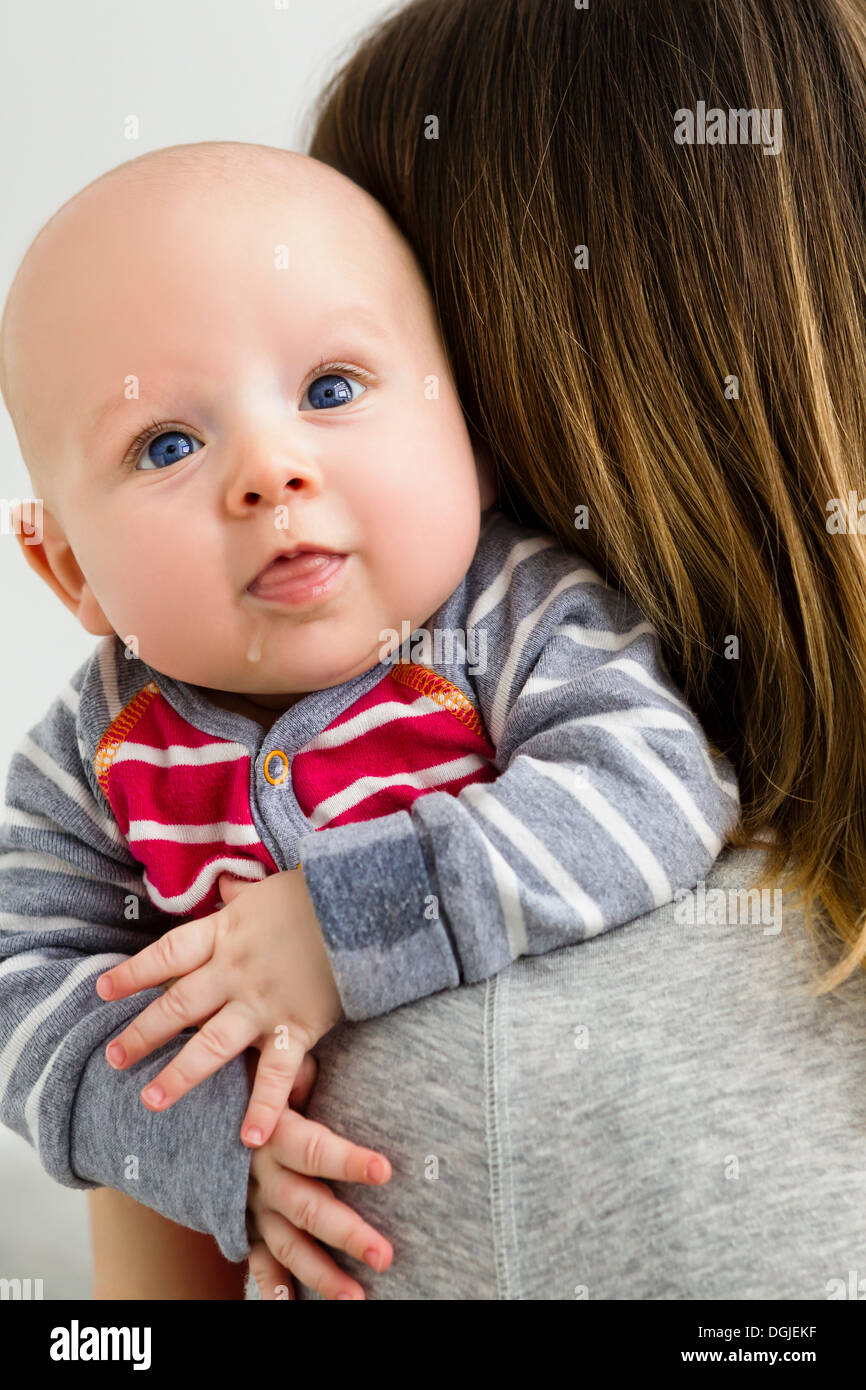 Baby over shoulders hi-res stock photography and images - Alamy