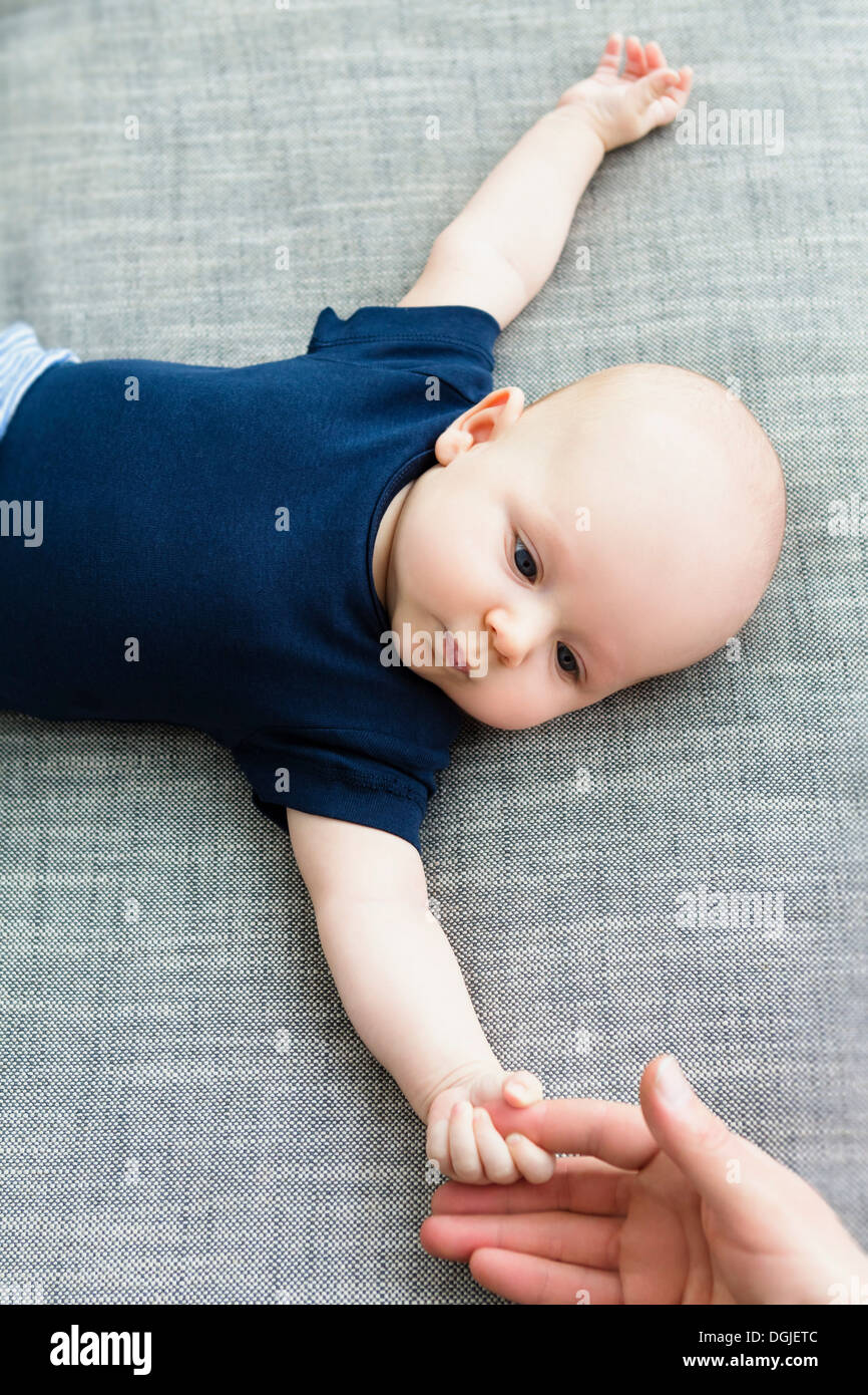 Holding baby back view hi-res stock photography and images - Alamy