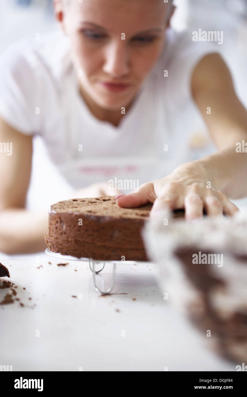 Female chef working on cake hi-res stock photography and images - Alamy
