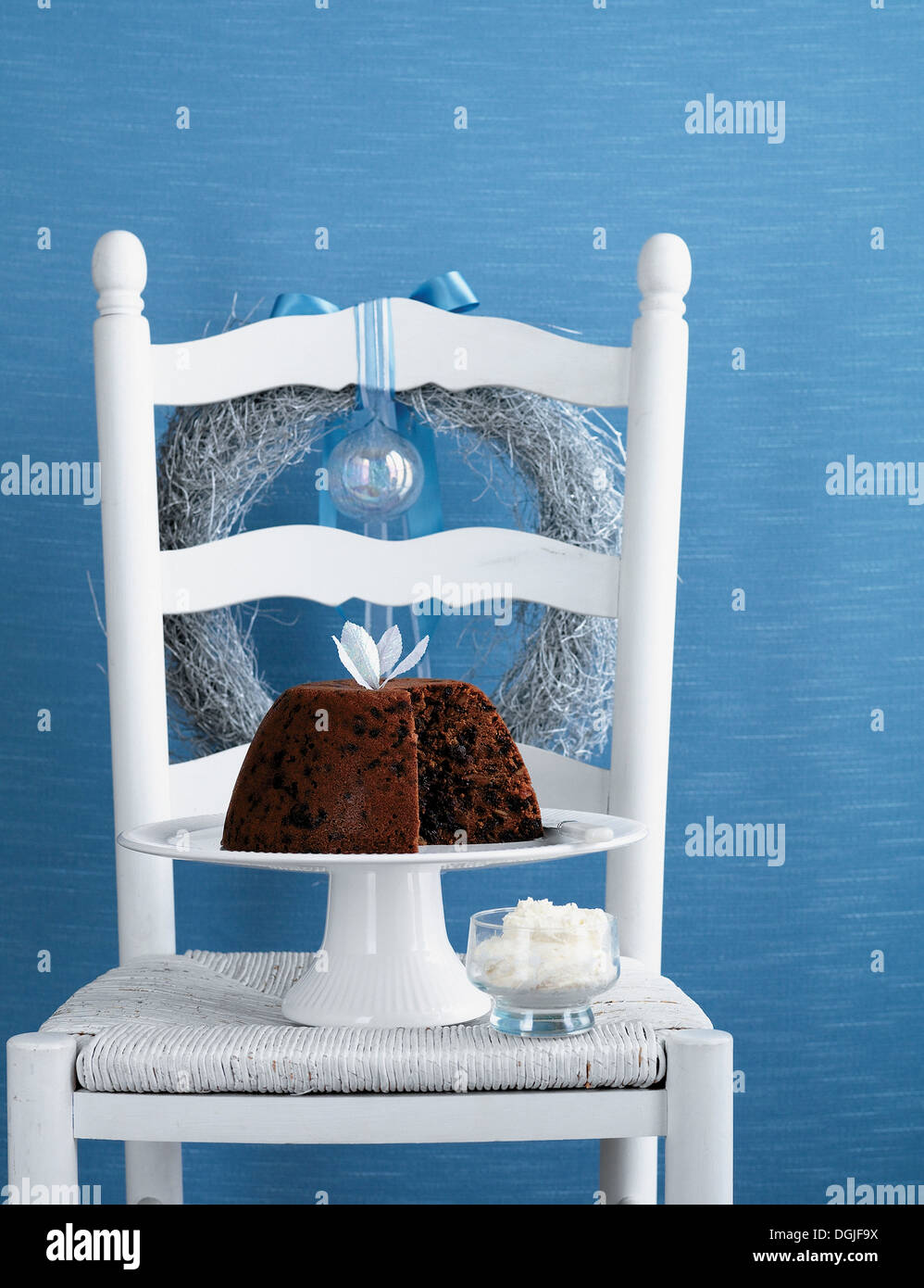 Fruitcake on cake stand on white chair Stock Photo - Alamy