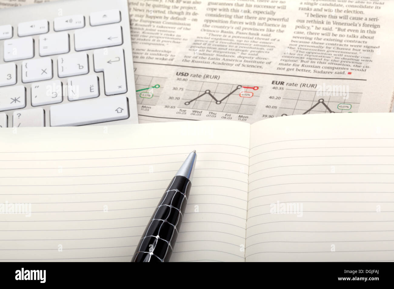 Business photo: fresh newspaper with stock index overview and open note ...