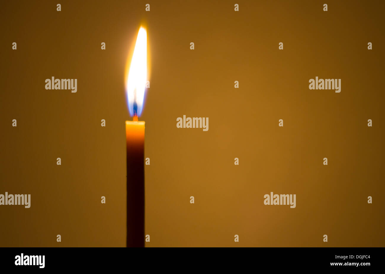 One candle flame at night closeup - isolated Stock Photo - Alamy