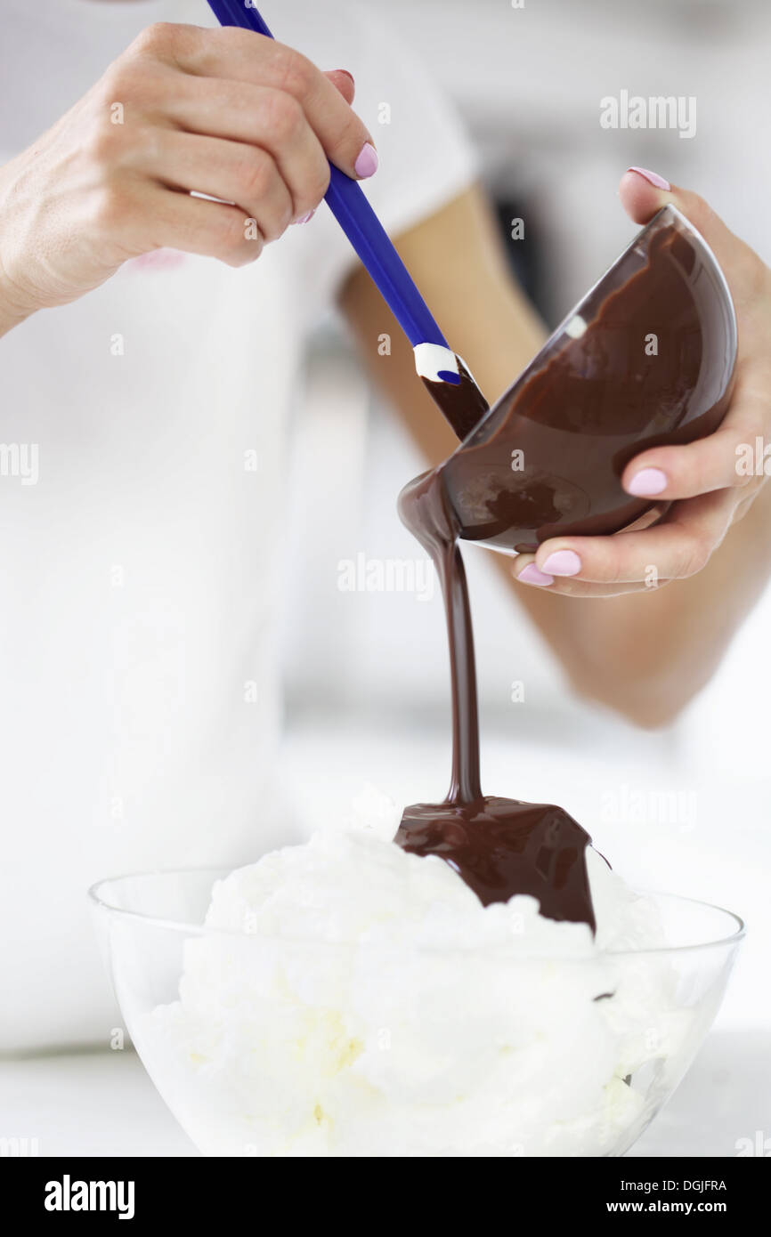 Baker pouring melted chocolate on hi-res stock photography and images ...