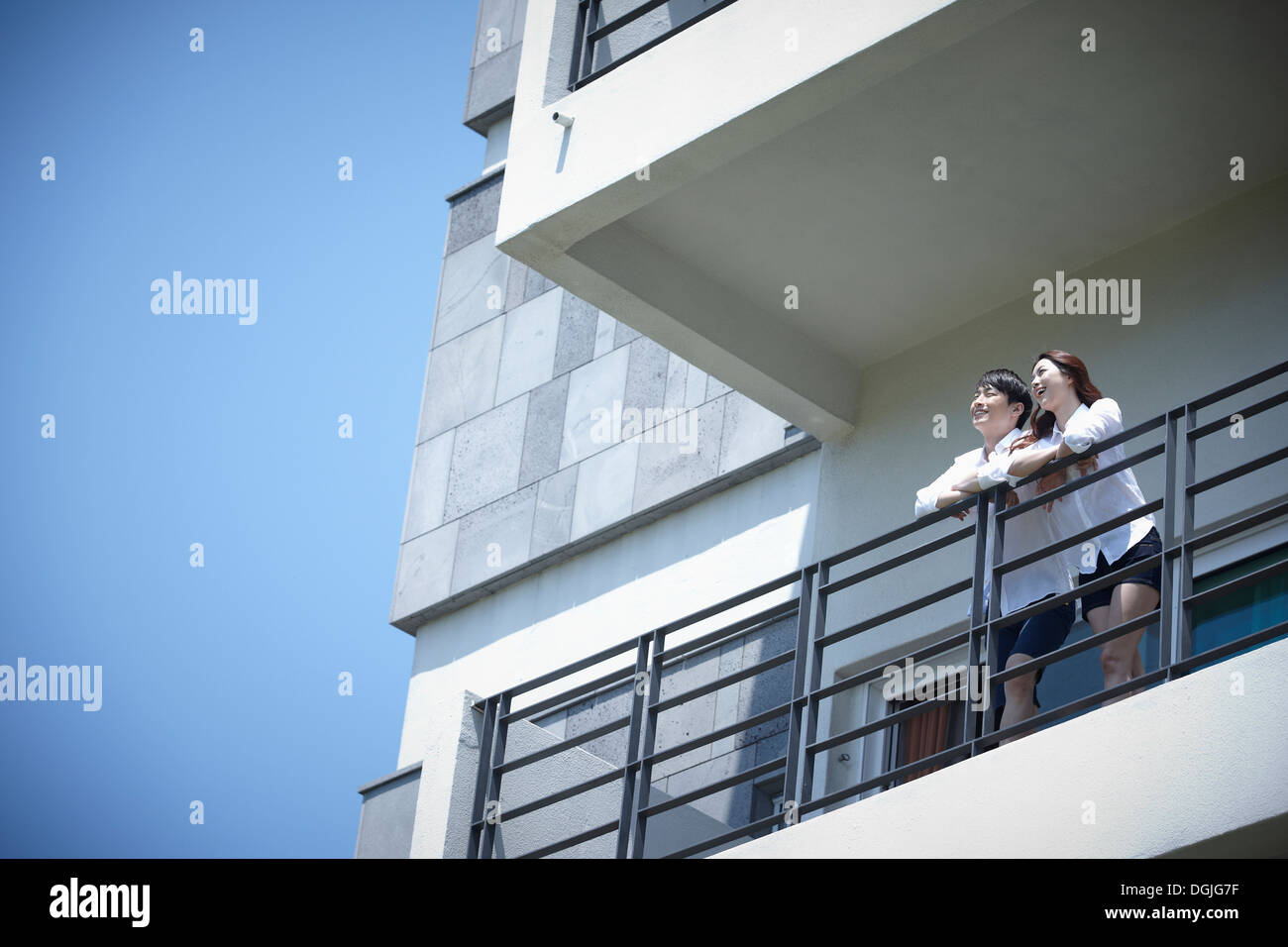 Standing on their balcony hi-res stock photography and images - Alamy