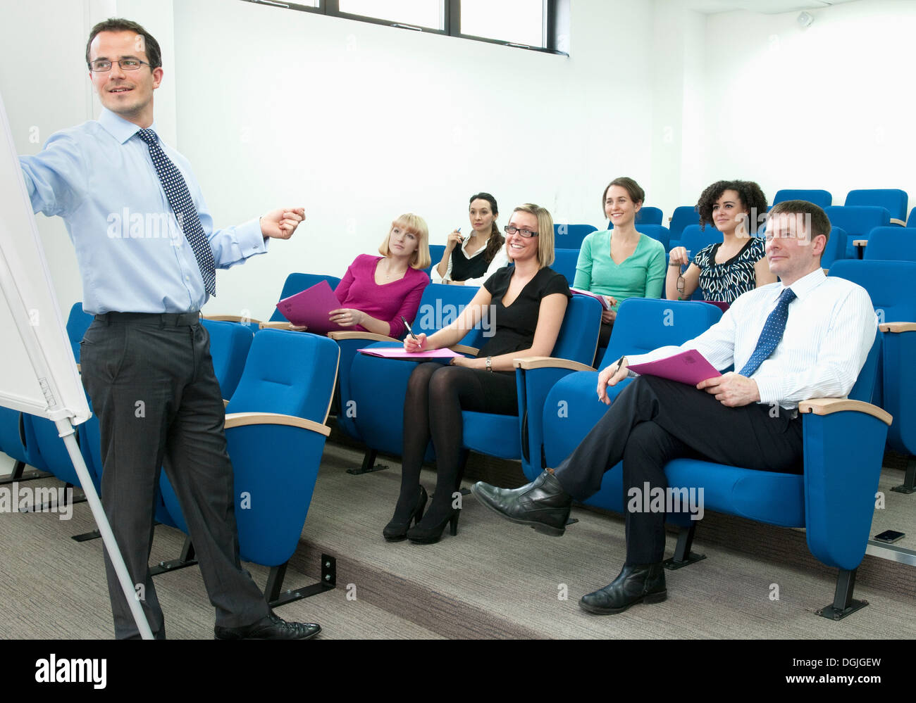 Colleagues listening speaker business hi-res stock photography and ...