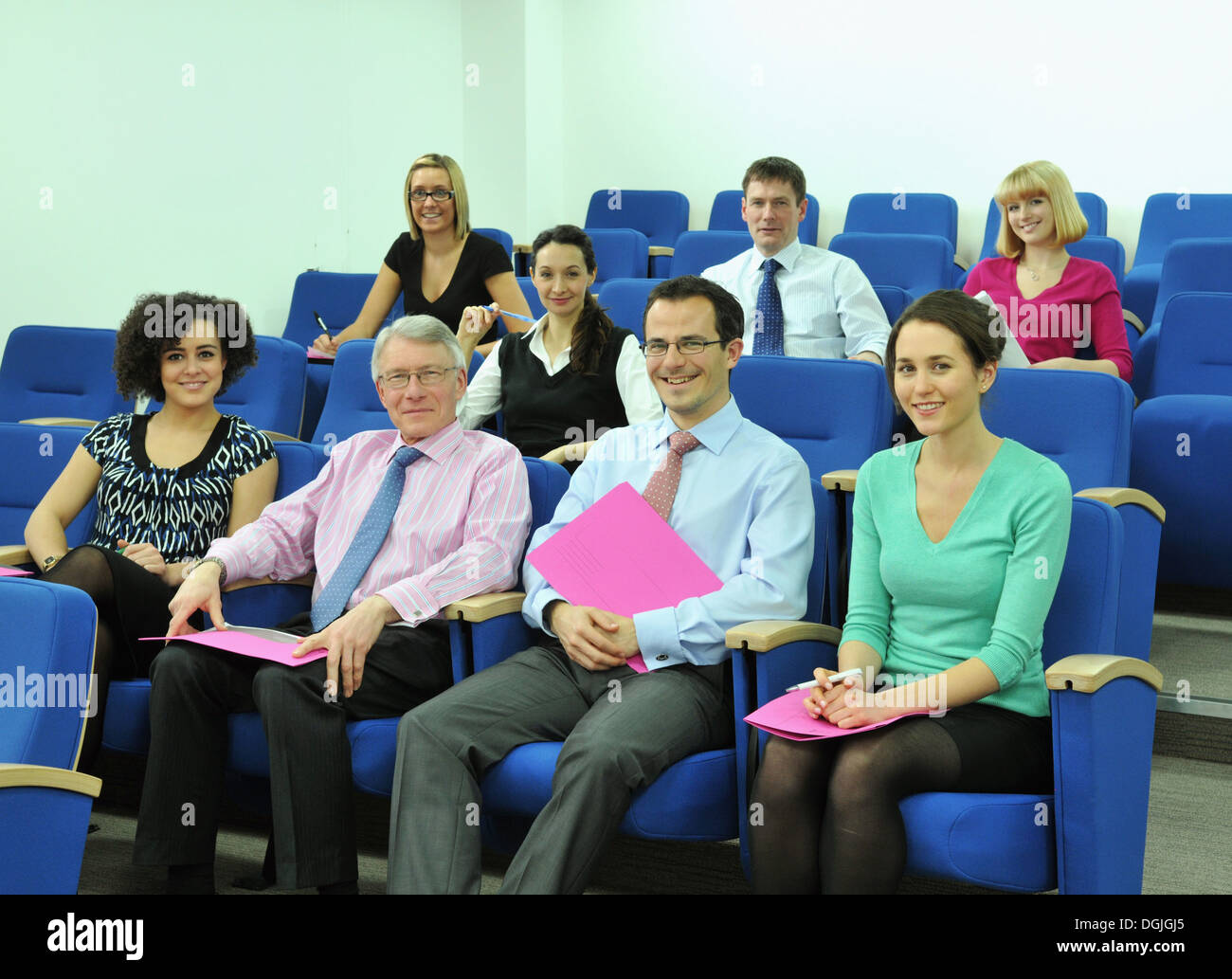 Group of colleagues sitting for presentation Stock Photo - Alamy