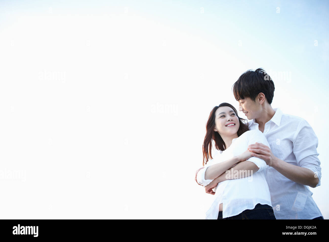 Couple hug arms hi-res stock photography and images - Alamy