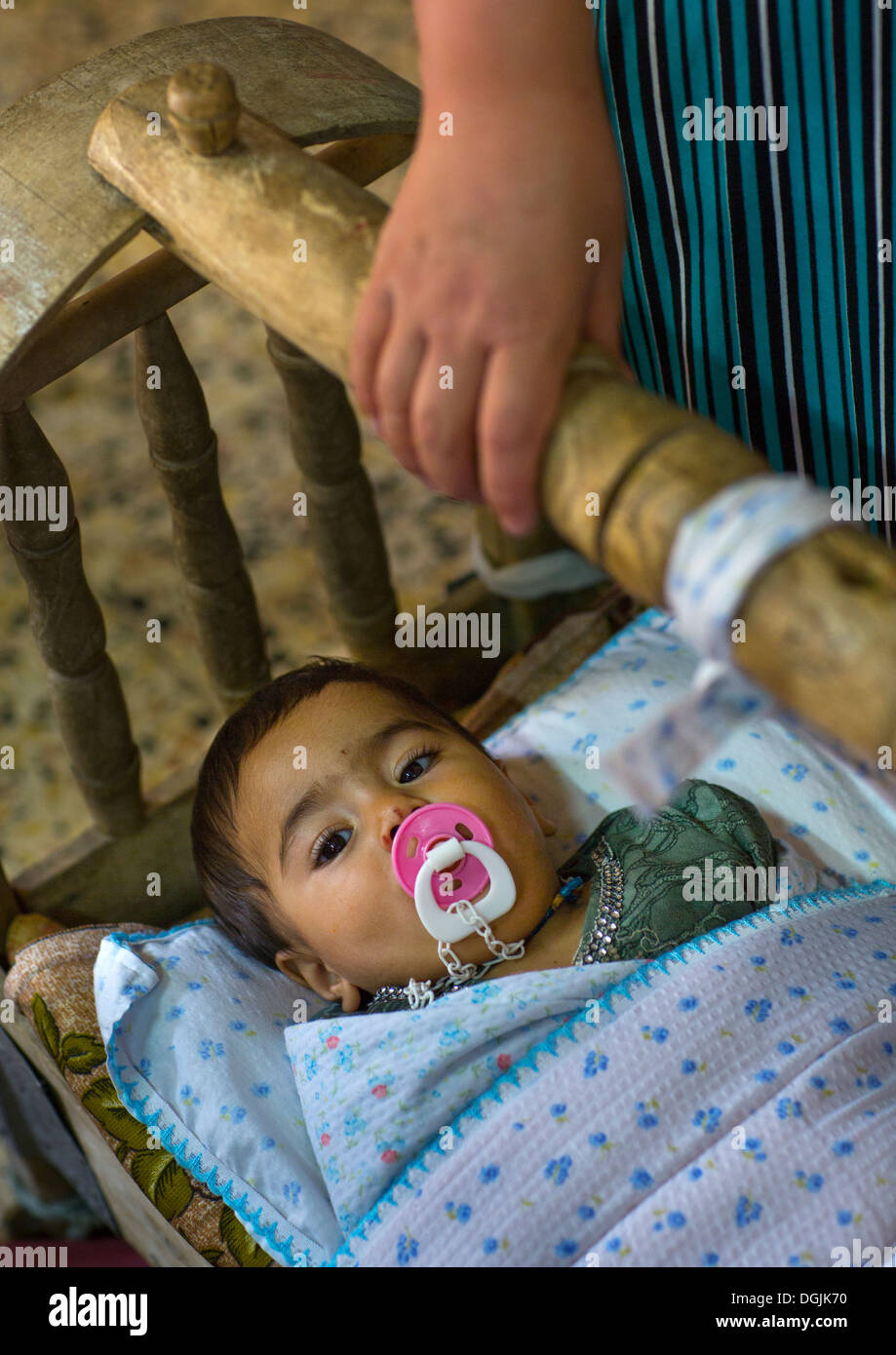 Kurdish baby in traditional bed hi-res stock photography and images - Alamy