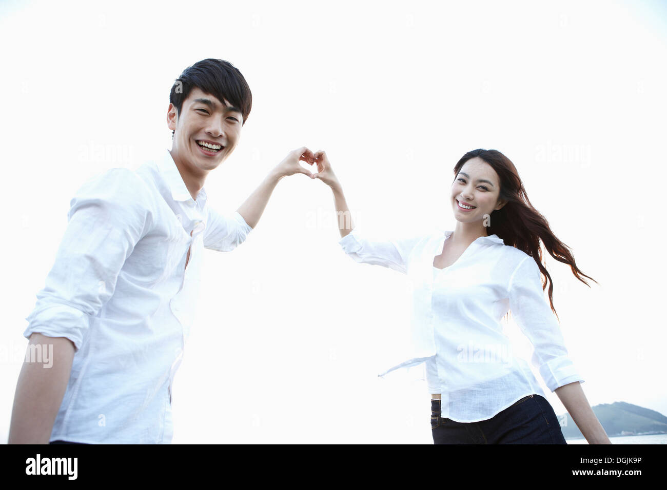 Couple hand heart hi-res stock photography and images - Alamy