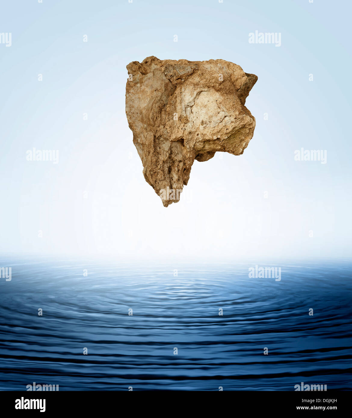 big rock floating on blue water Stock Photo - Alamy
