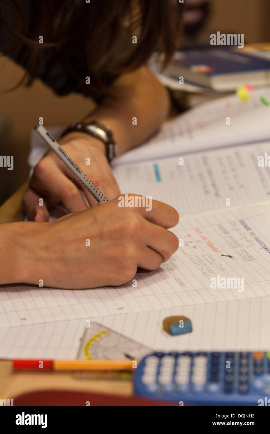 Young female student doing math hi-res stock photography and images - Alamy