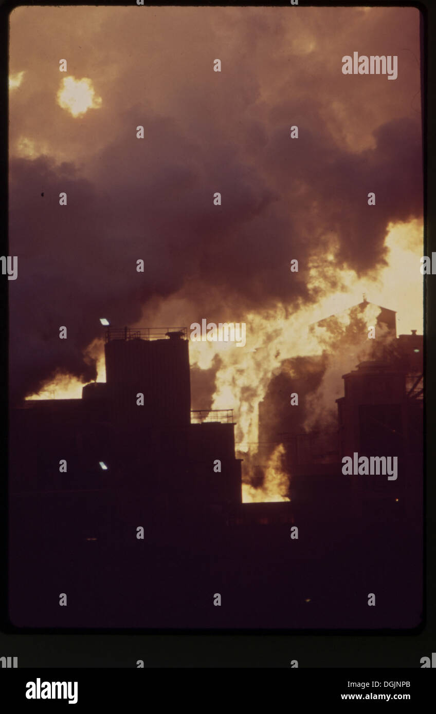 This photograph captures the morning sun in East Chicago, obscured by ...