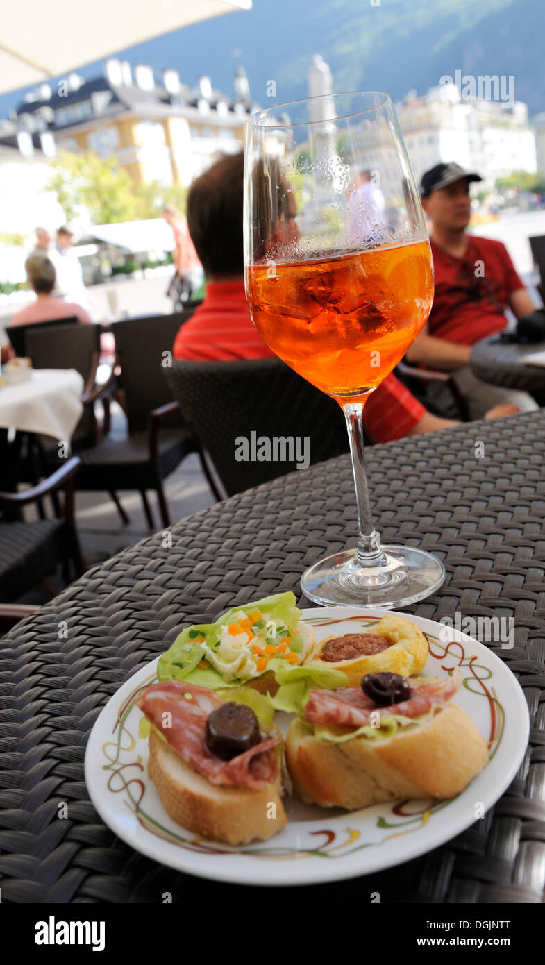 Aperol, an Italian aperitif, at a sidewalk cafe on Piazza Walther ...