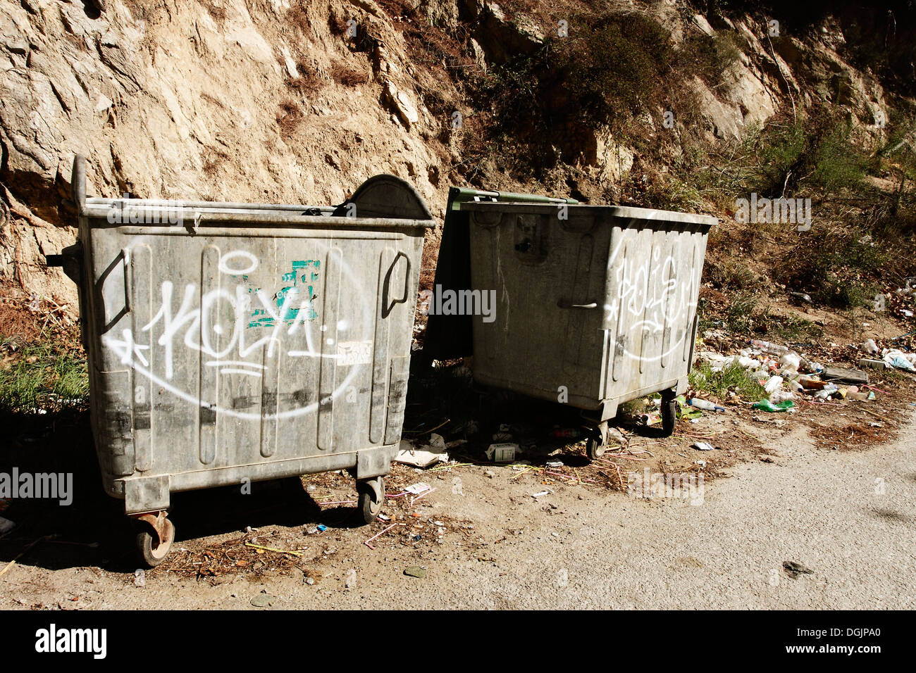Roadside refuse containers bearing Greek Graffiti Stock Photo - Alamy