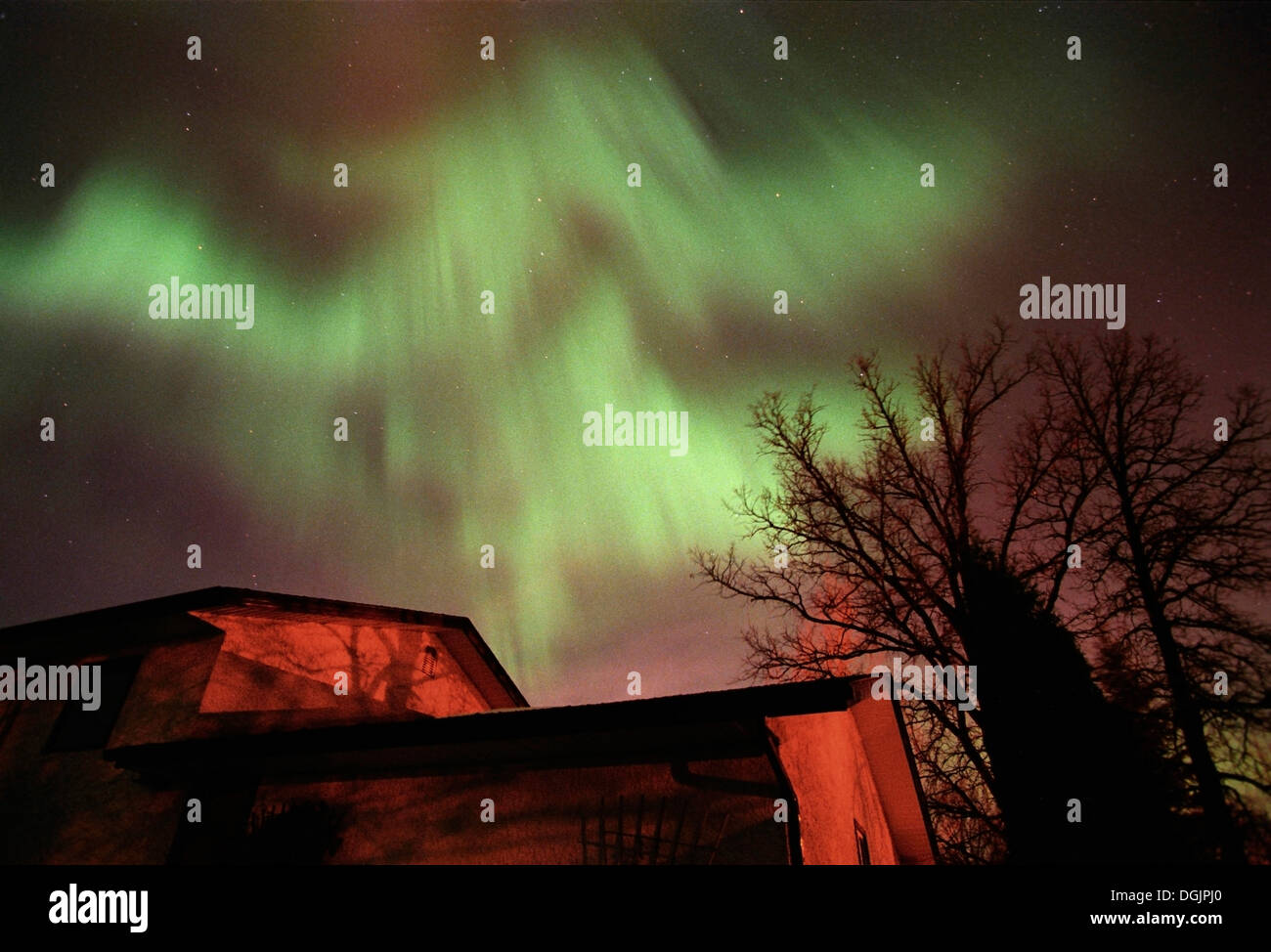 Aurora Borealis Northern Lights red and green explosion over house near ...
