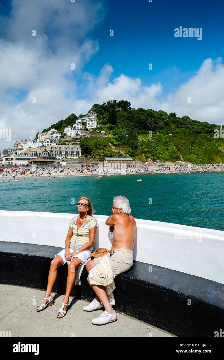 Couple sunbathing on a pier hi-res stock photography and images - Alamy