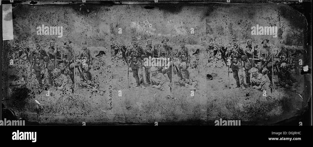 A group of military officers are photographed, showcasing their ...