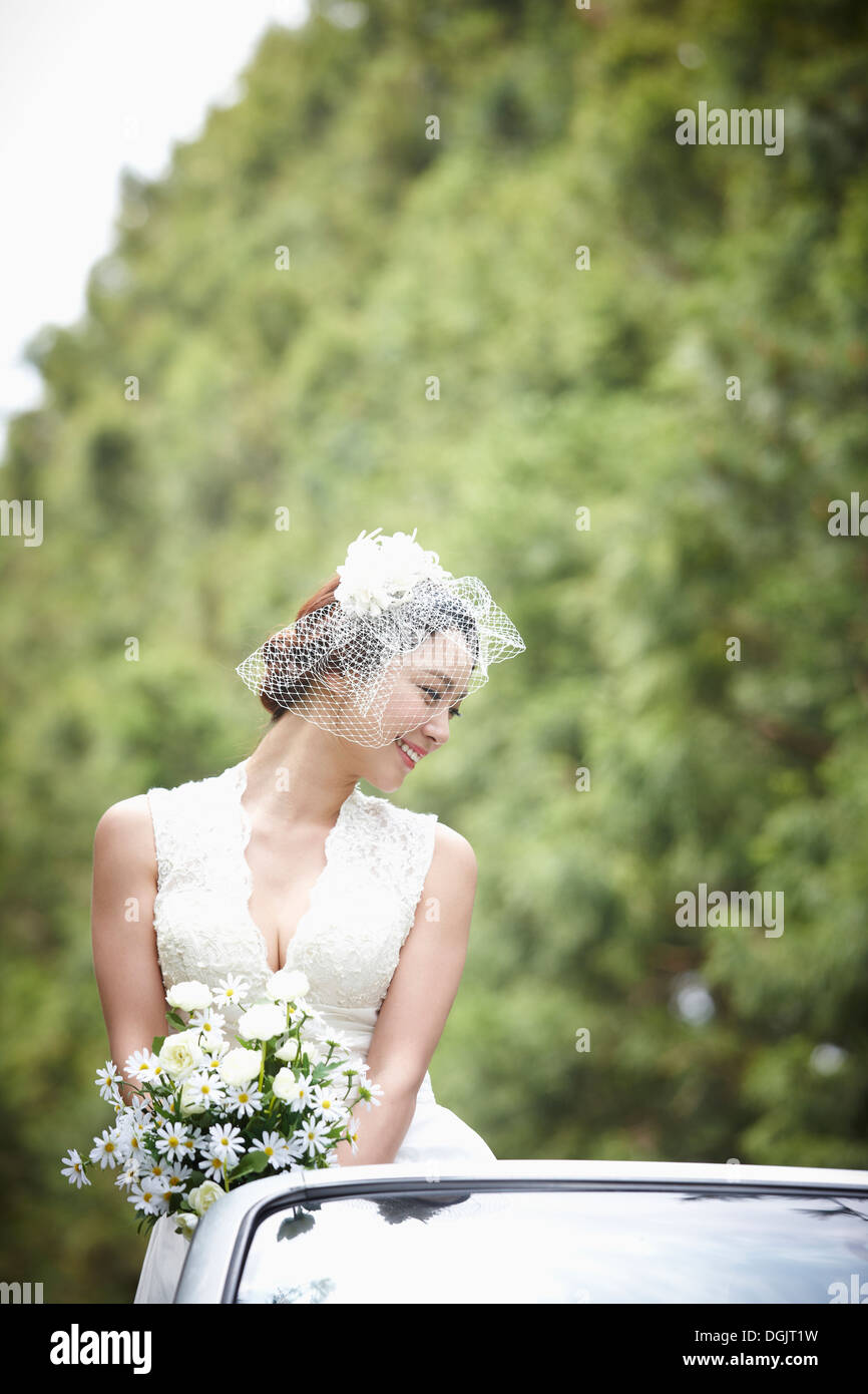 Bride standing in convertible car hi-res stock photography and images ...
