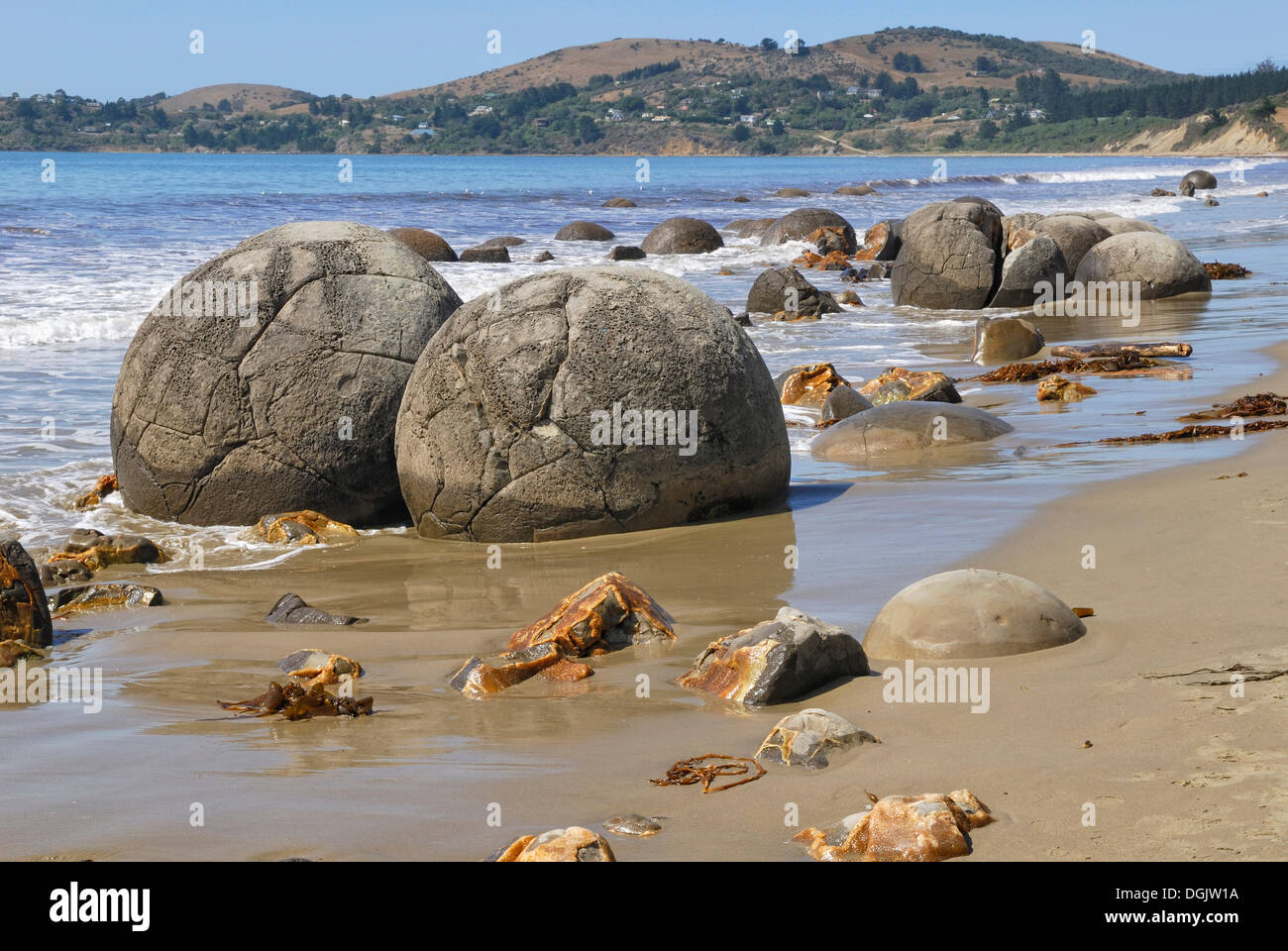 Rocks on a sandy beach, Moeraki Boulders, a geological rock formation ...