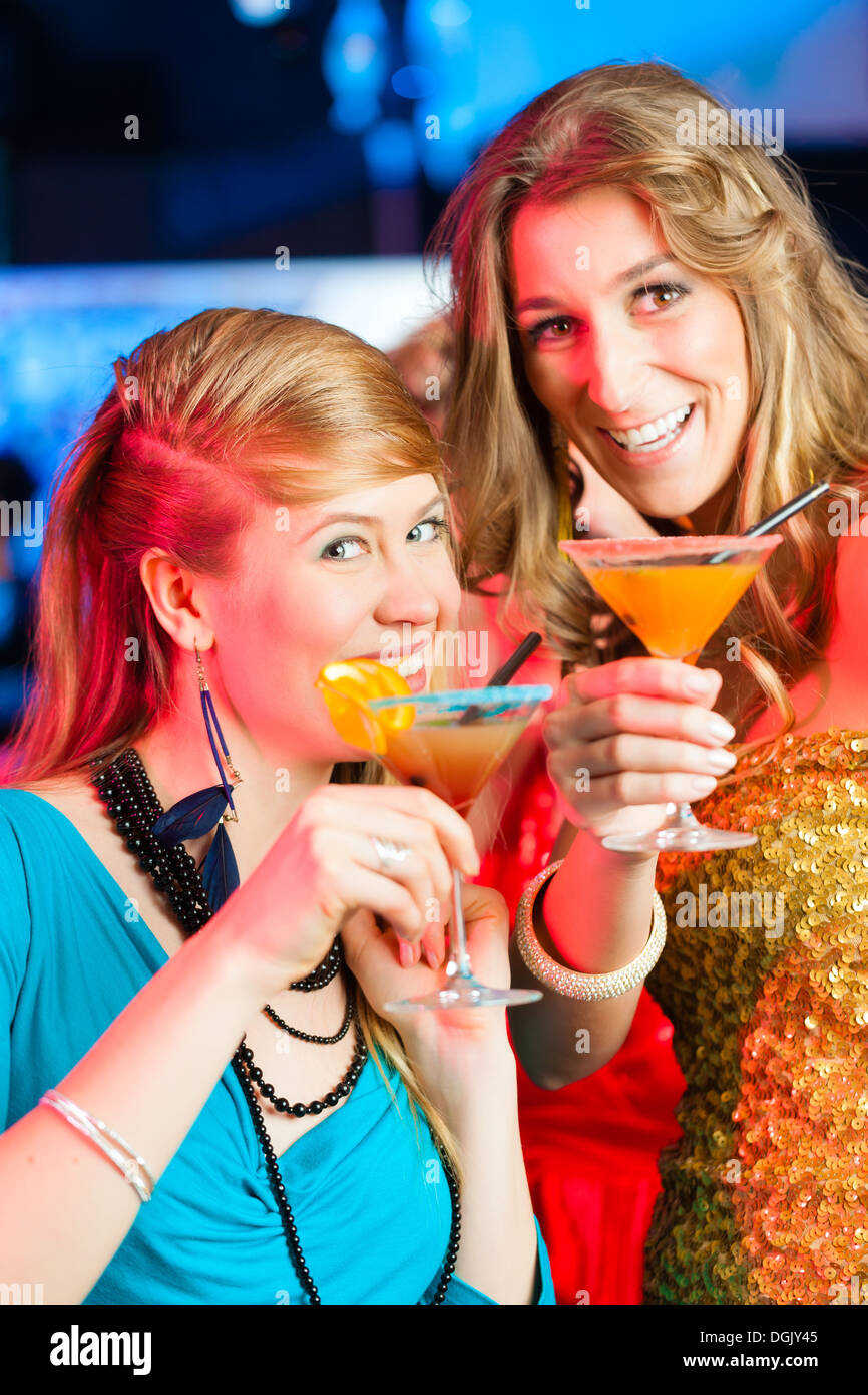 Young women in club or bar drinking cocktails and having fun Stock ...