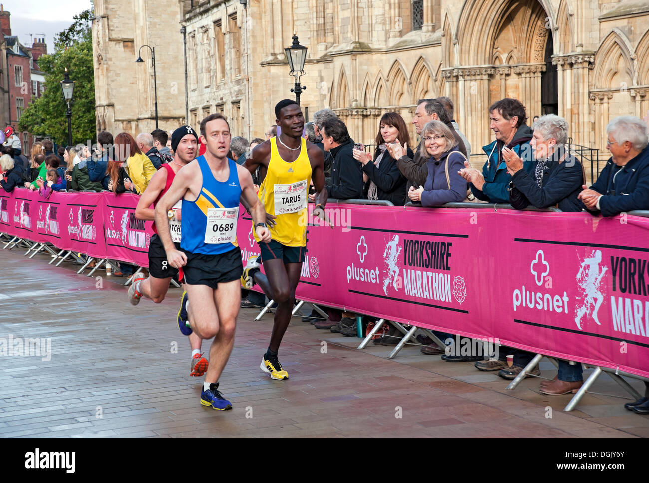 People running runners in the Plusnet Yorkshire Marathon Minster ...