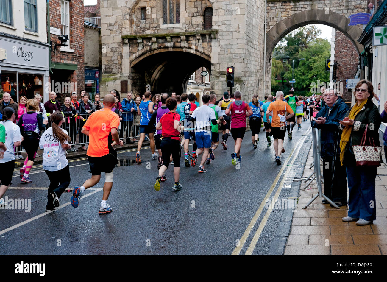 People running runners in the Plusnet Yorkshire Marathon Monkgate York ...