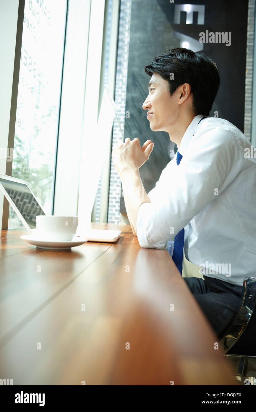 a business man working at a table Stock Photo - Alamy