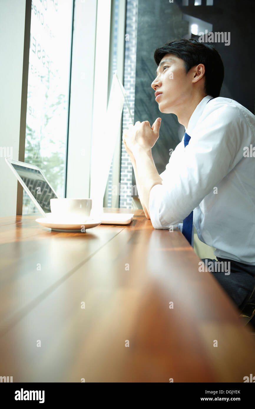 a business man working at a table Stock Photo - Alamy
