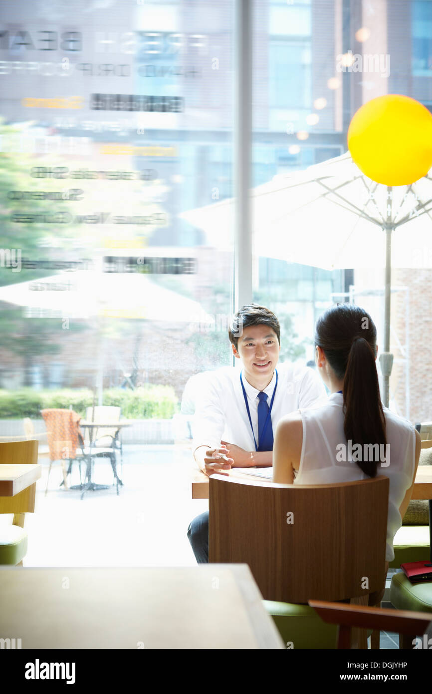 Business man behind the table hi-res stock photography and images - Alamy