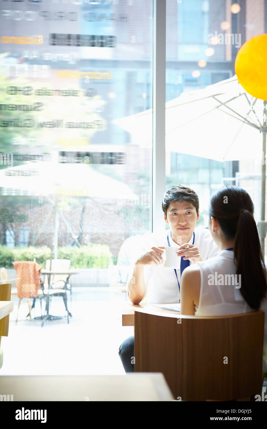 Asian woman behind table hi-res stock photography and images - Alamy