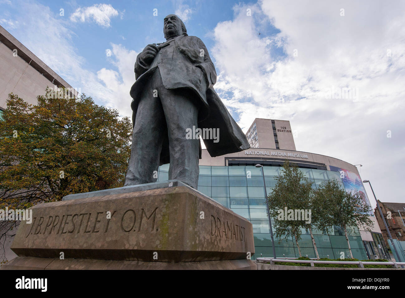 Under blue sky, lifelike bronze statue of J.B Priestley outside Science ...