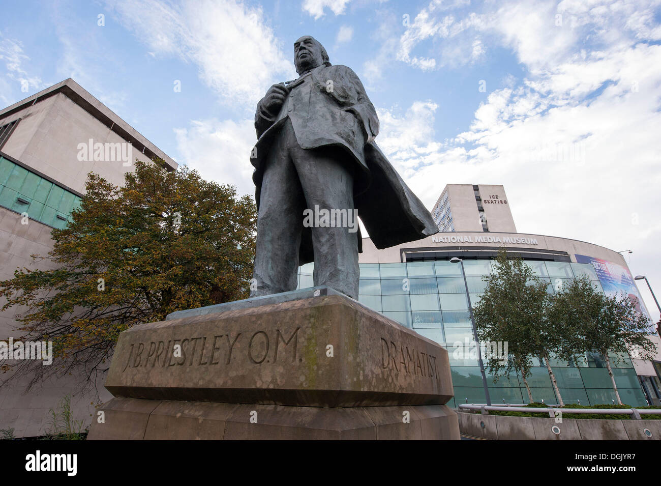 Under blue sky, lifelike bronze statue of J.B Priestley outside Science ...