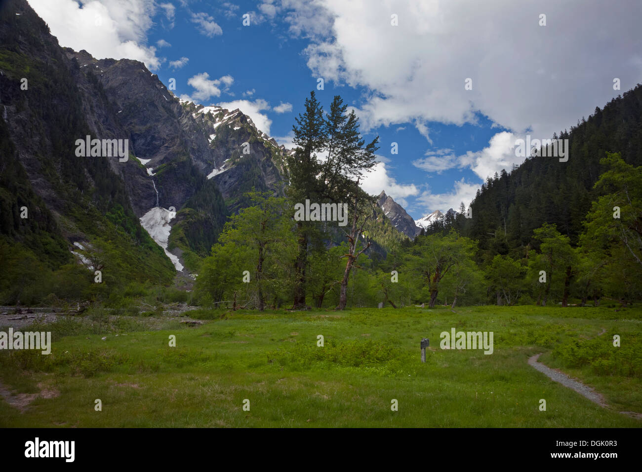WASHINGTON - Waterfalls on the cliffs rising above the meadows of the ...