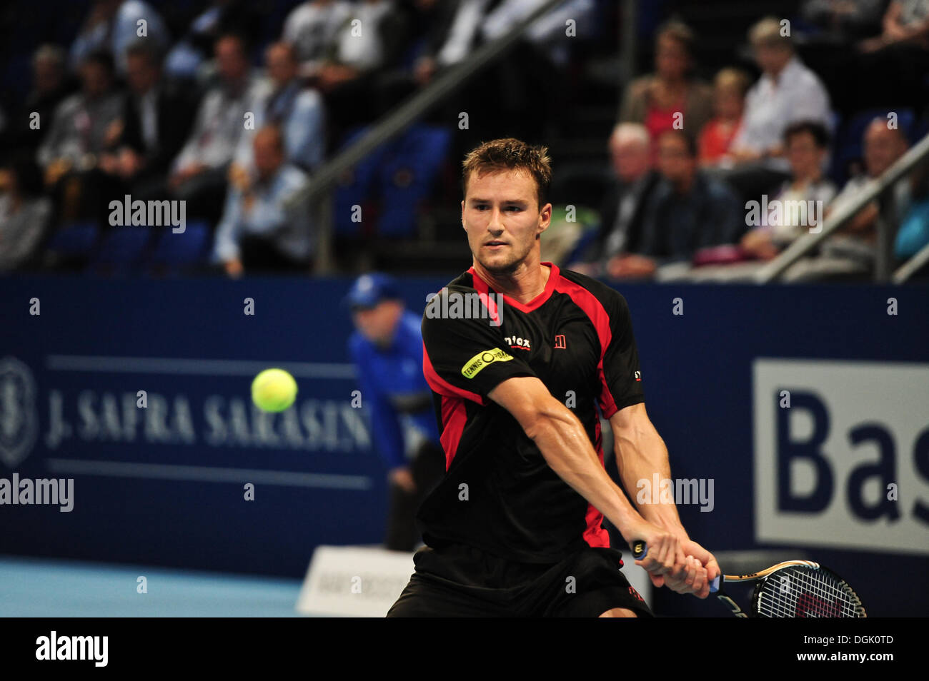 Basel, Switzerland. 22nd Oct, 2013. Marco Chiudinelli (SUI) returns the ...